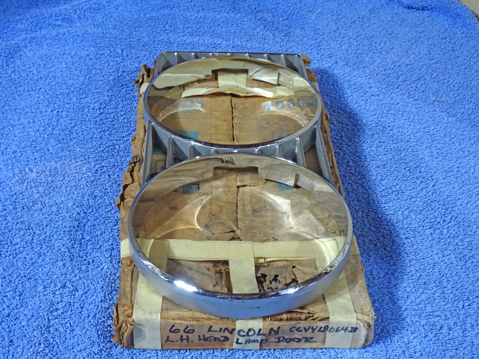 1966 Lincoln Continental Chrome Headlamp Door Bezel NOS | Classic NOS Parts